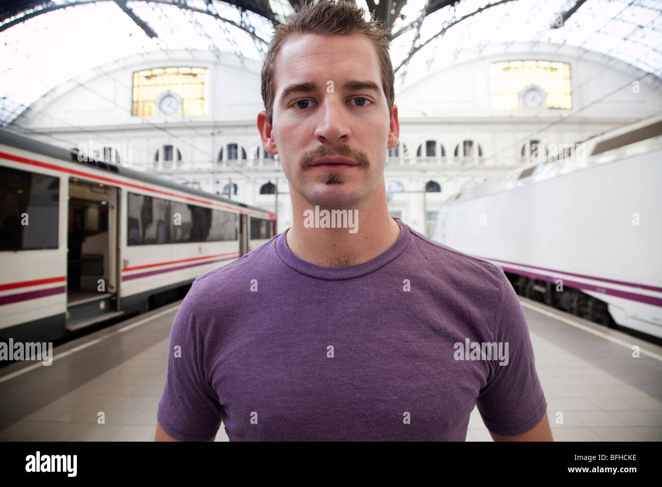 young man at the train station Stock Photo - Alamy