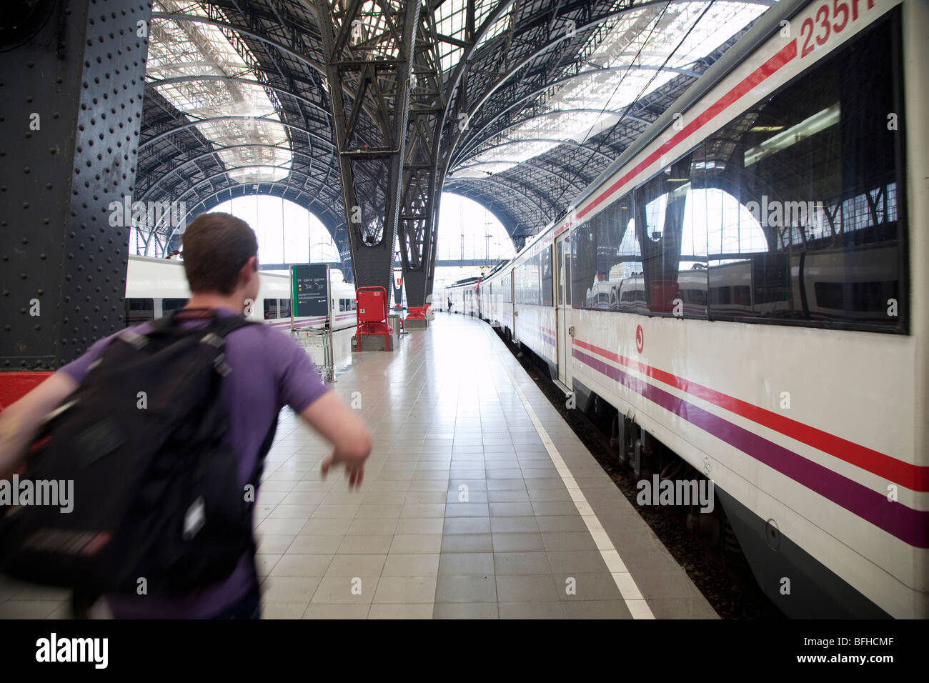 young man at the train station Stock Photo - Alamy