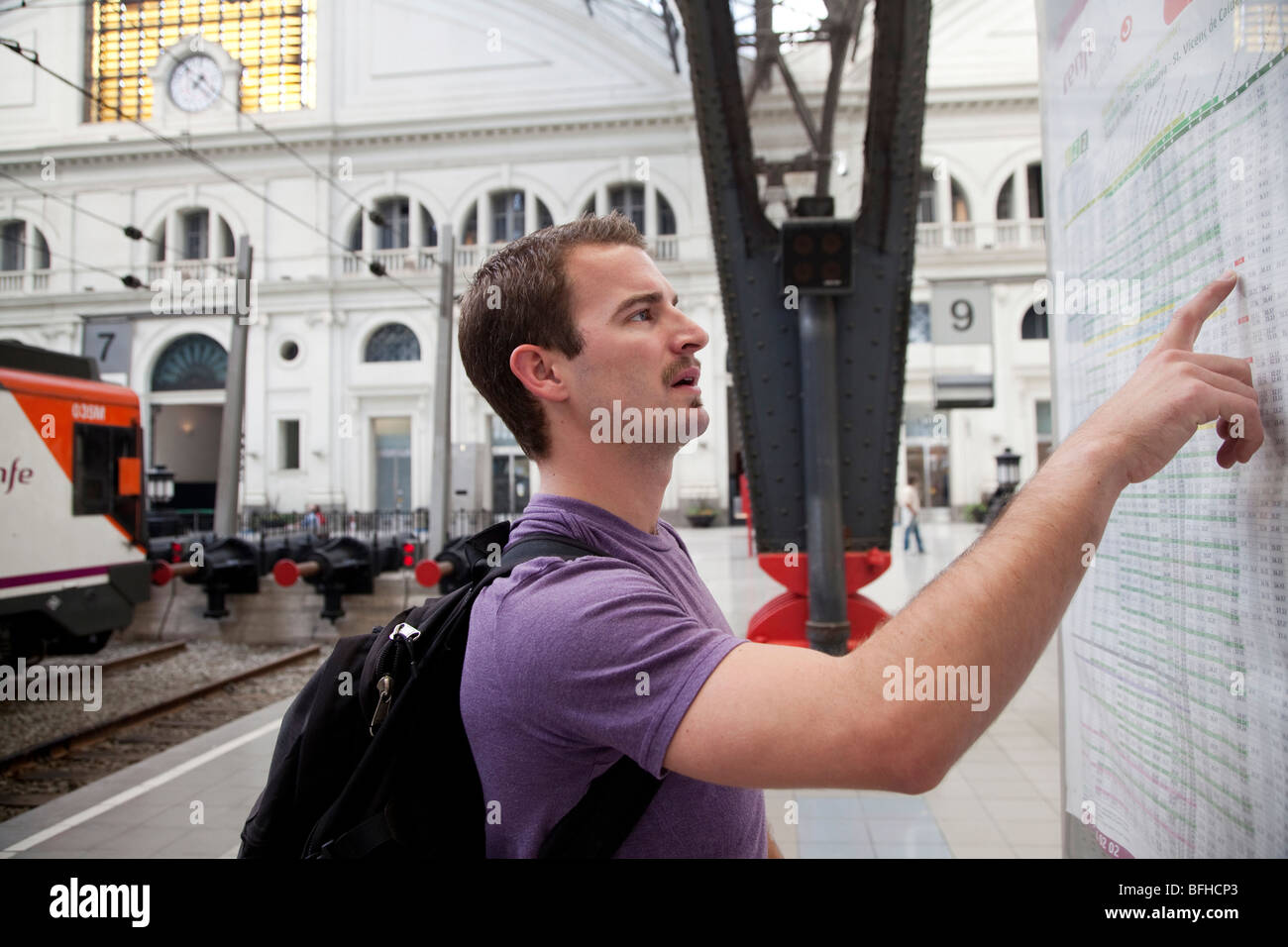 young man at the train station Stock Photo - Alamy