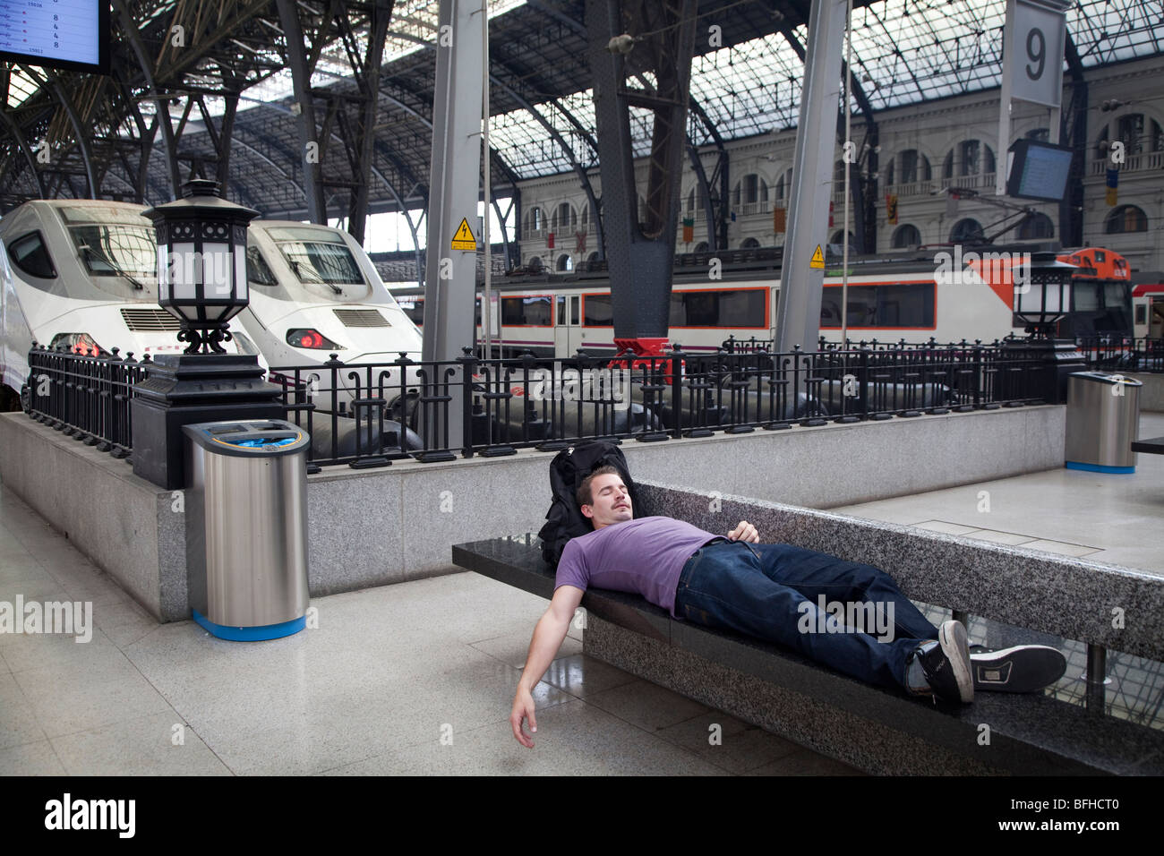 Man standing train station bench hi-res stock photography and images ...