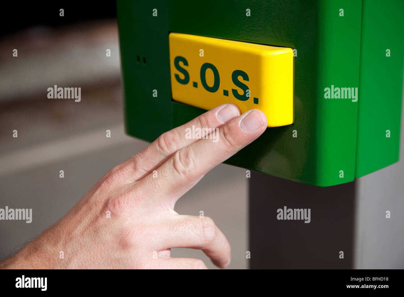 Pushing SOS button Stock Photo - Alamy