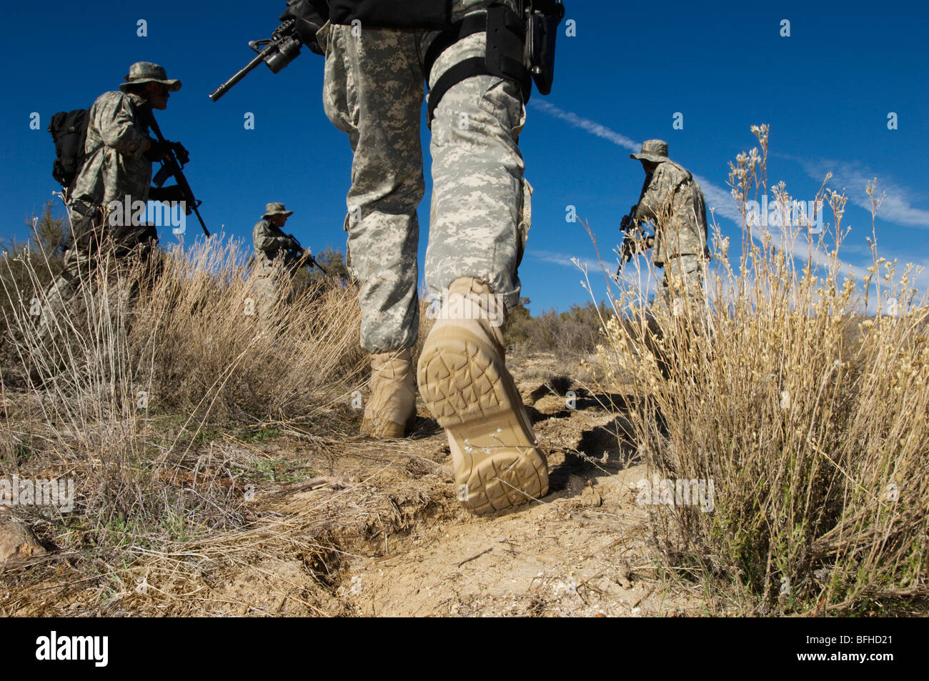 Soldiers walking in desert, low section Stock Photo - Alamy