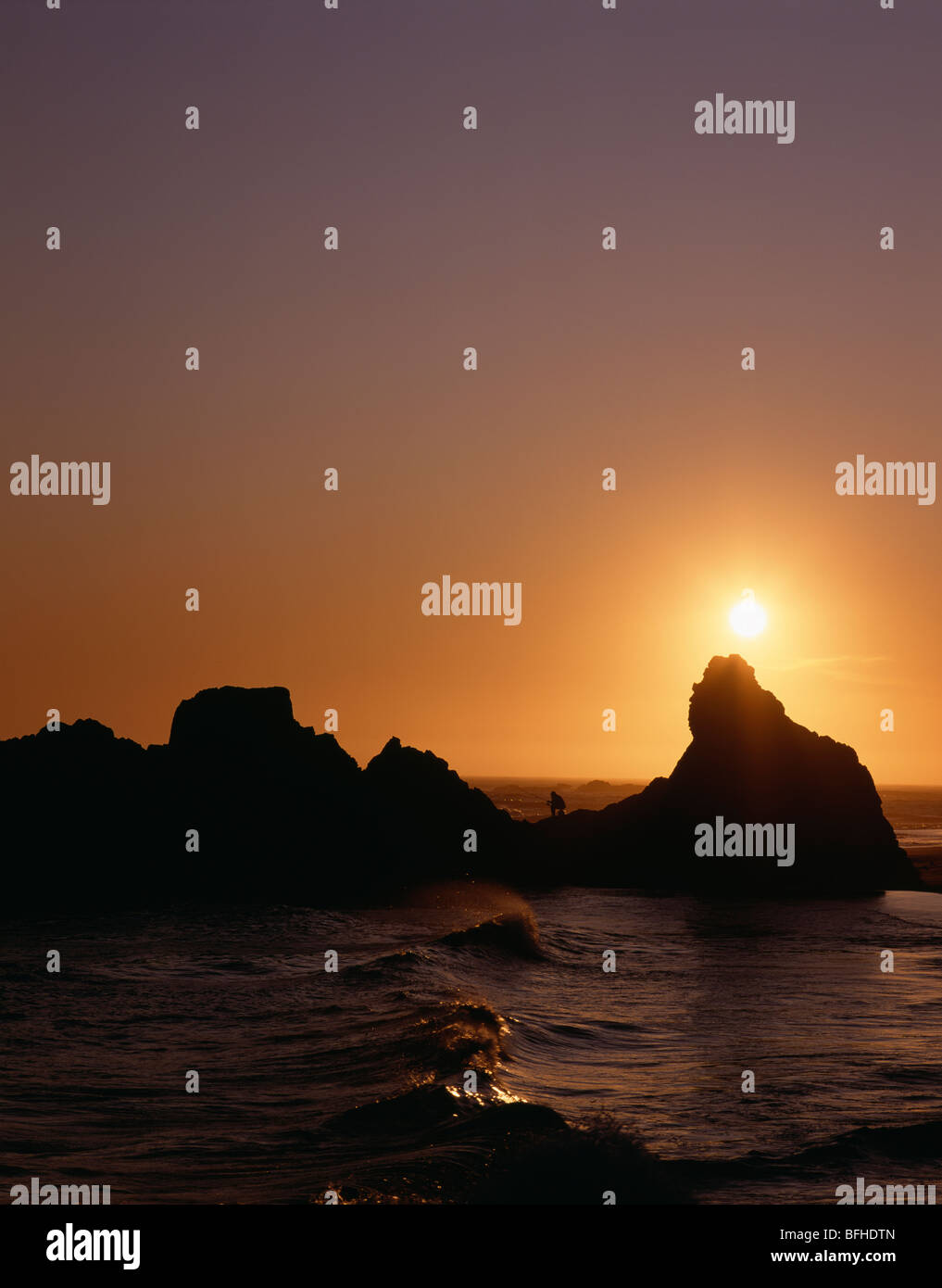Southern Oregon Coastline with silhouetted rock formations and ...