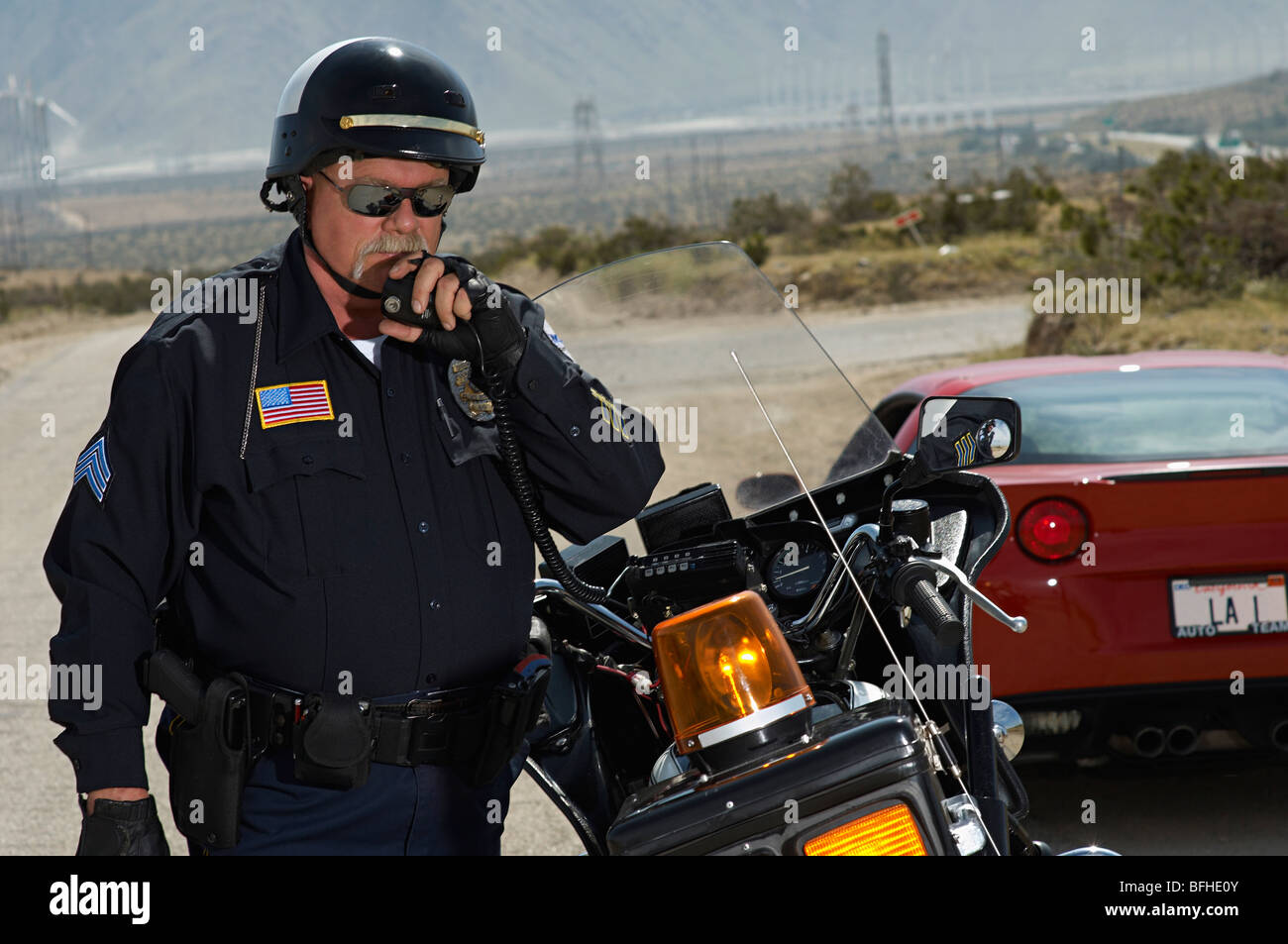 Portrait of traffic cop using radio Stock Photo - Alamy