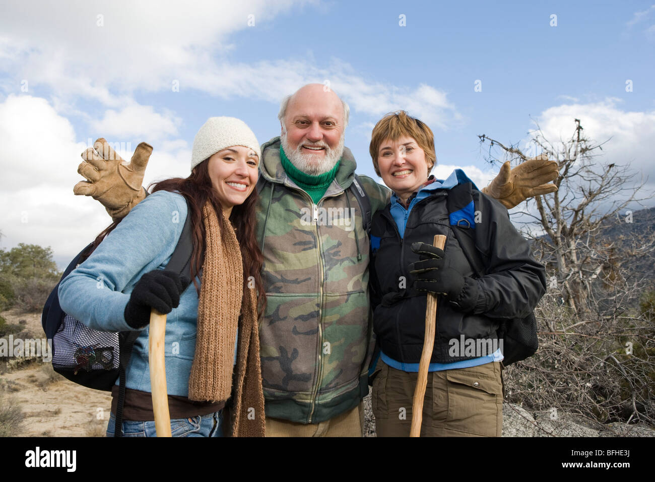 Three hikers standing on the trail Stock Photo - Alamy