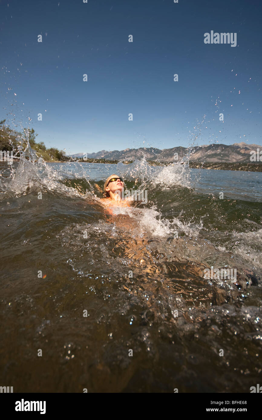 A splash is made when this female jumps into Windermere Lake, just ...