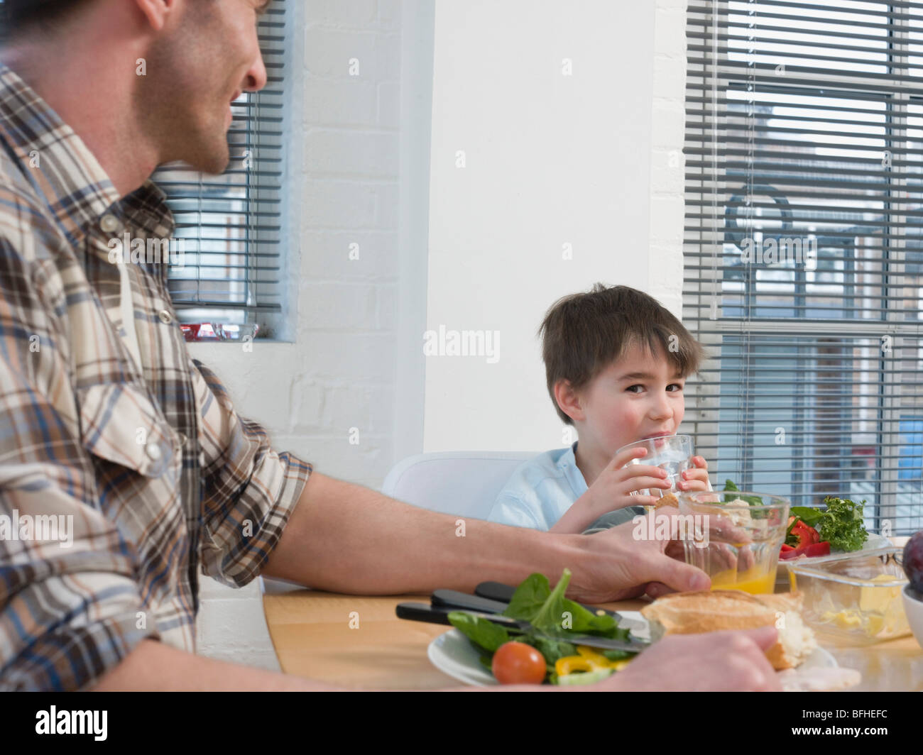 Father and Son at Dinner Table Stock Photo - Alamy