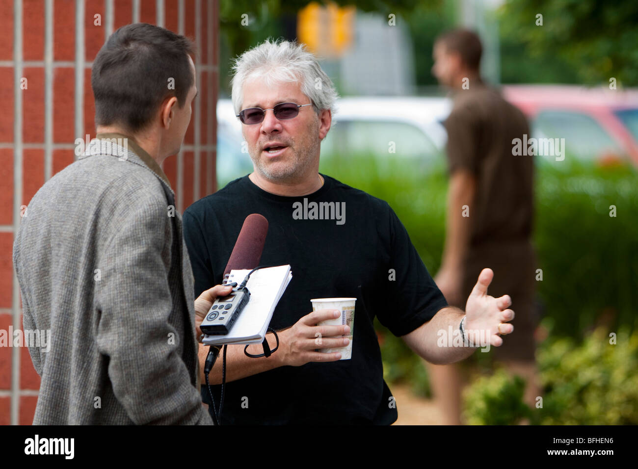 Storm chaser and scientist Josh Wurman speaks to an NPR reporter in ...