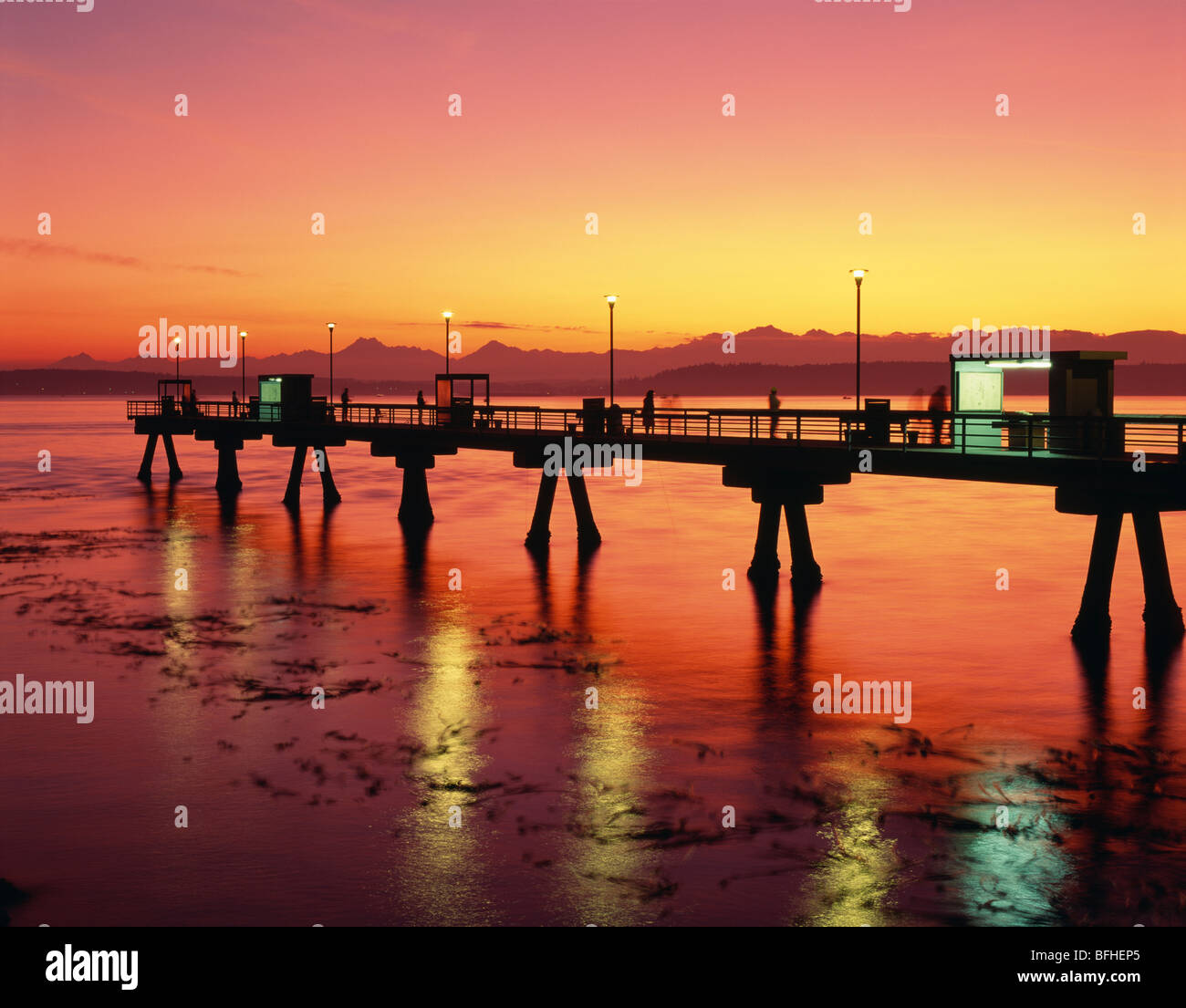Dramatic sunset over Puget Sound and the Olympic Mountains with ...