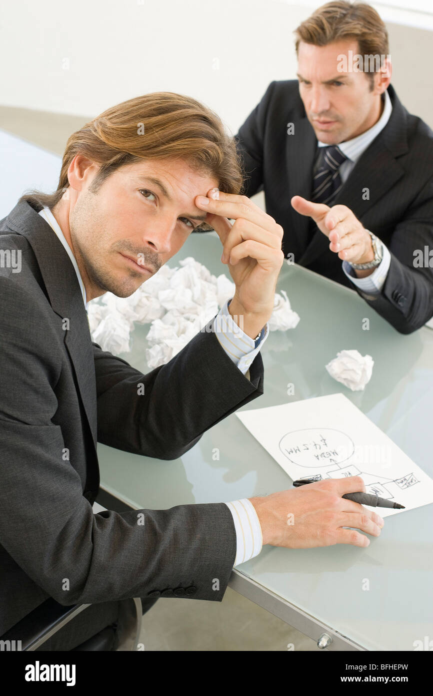 Business men working at conference table Stock Photo - Alamy