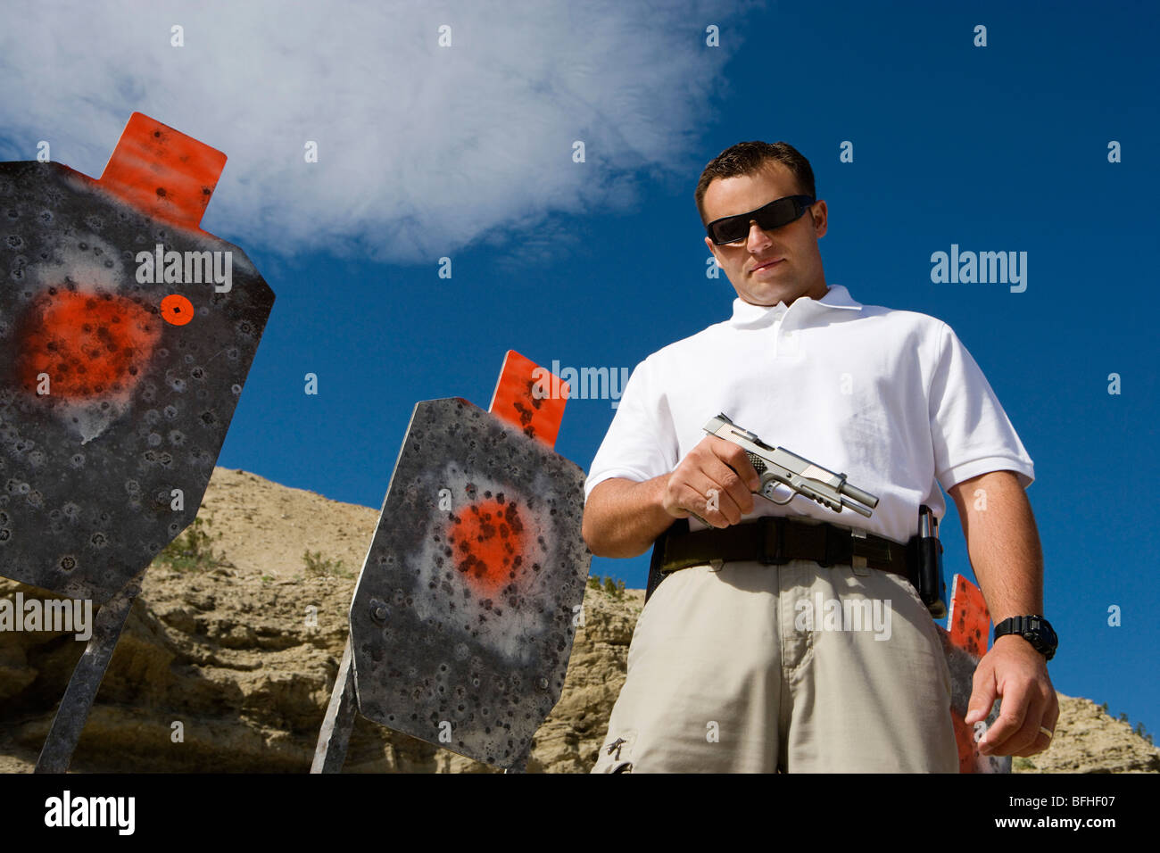 Man holding shooting target hi-res stock photography and images - Alamy