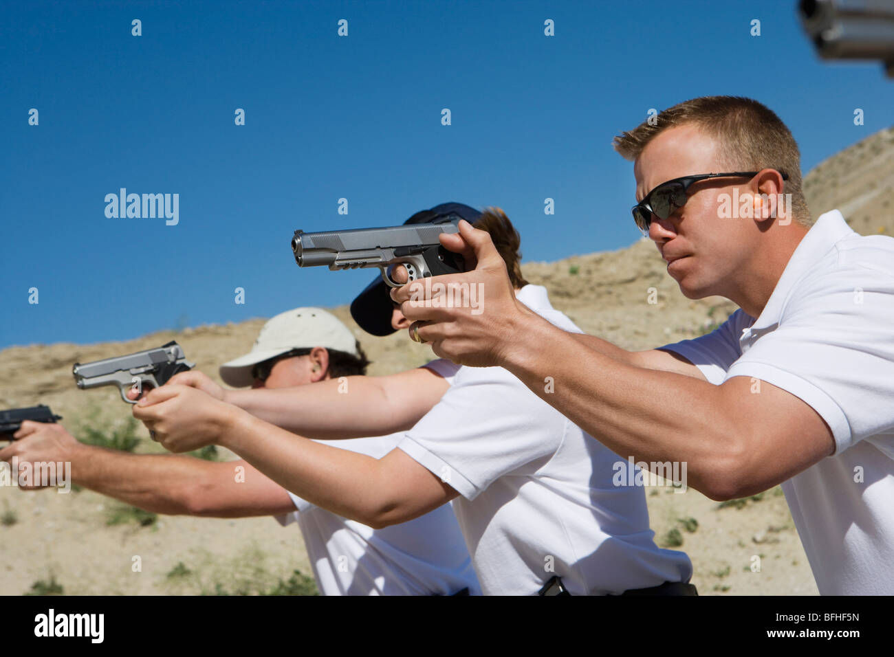 People Shooting Guns