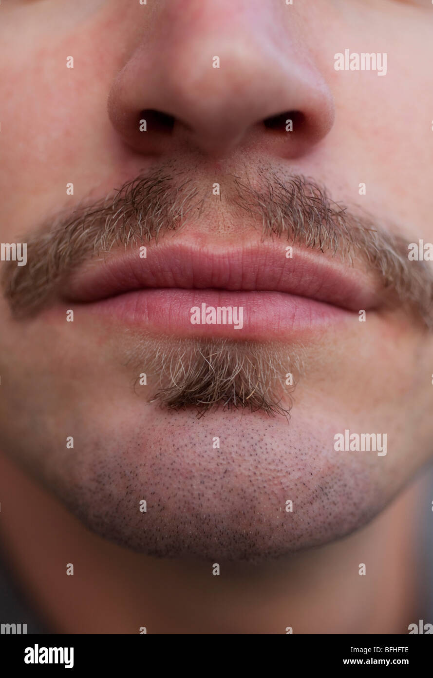 Extreme close up on a mouth and mustache of a young male Stock Photo ...