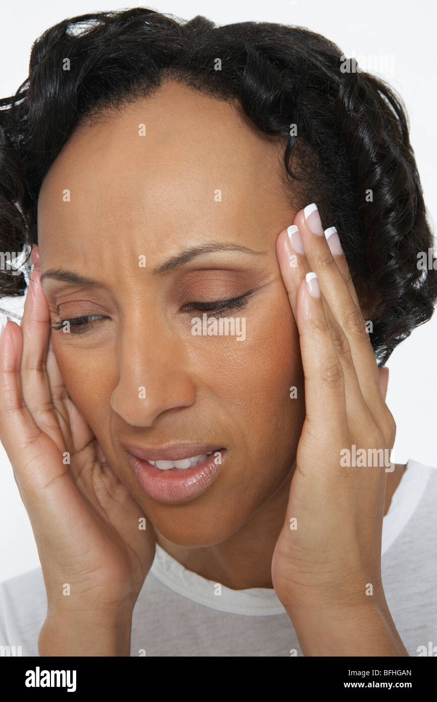 Woman with head in hands, close-up Stock Photo - Alamy