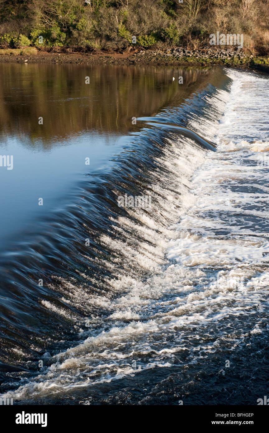 Weir and flood defence on the River Coquet in Northumberland near ...