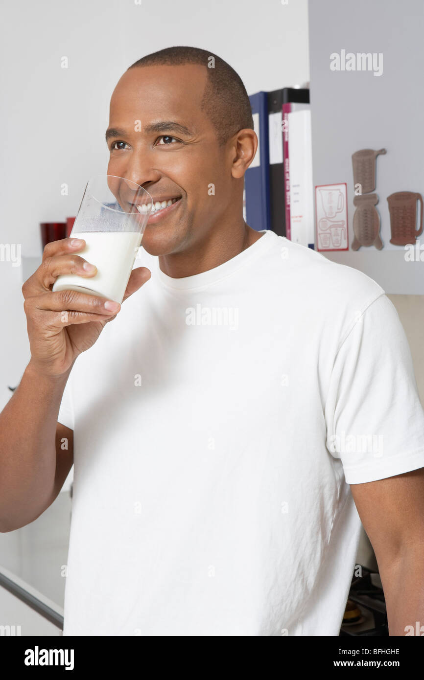 Man drinking milk in office Stock Photo - Alamy