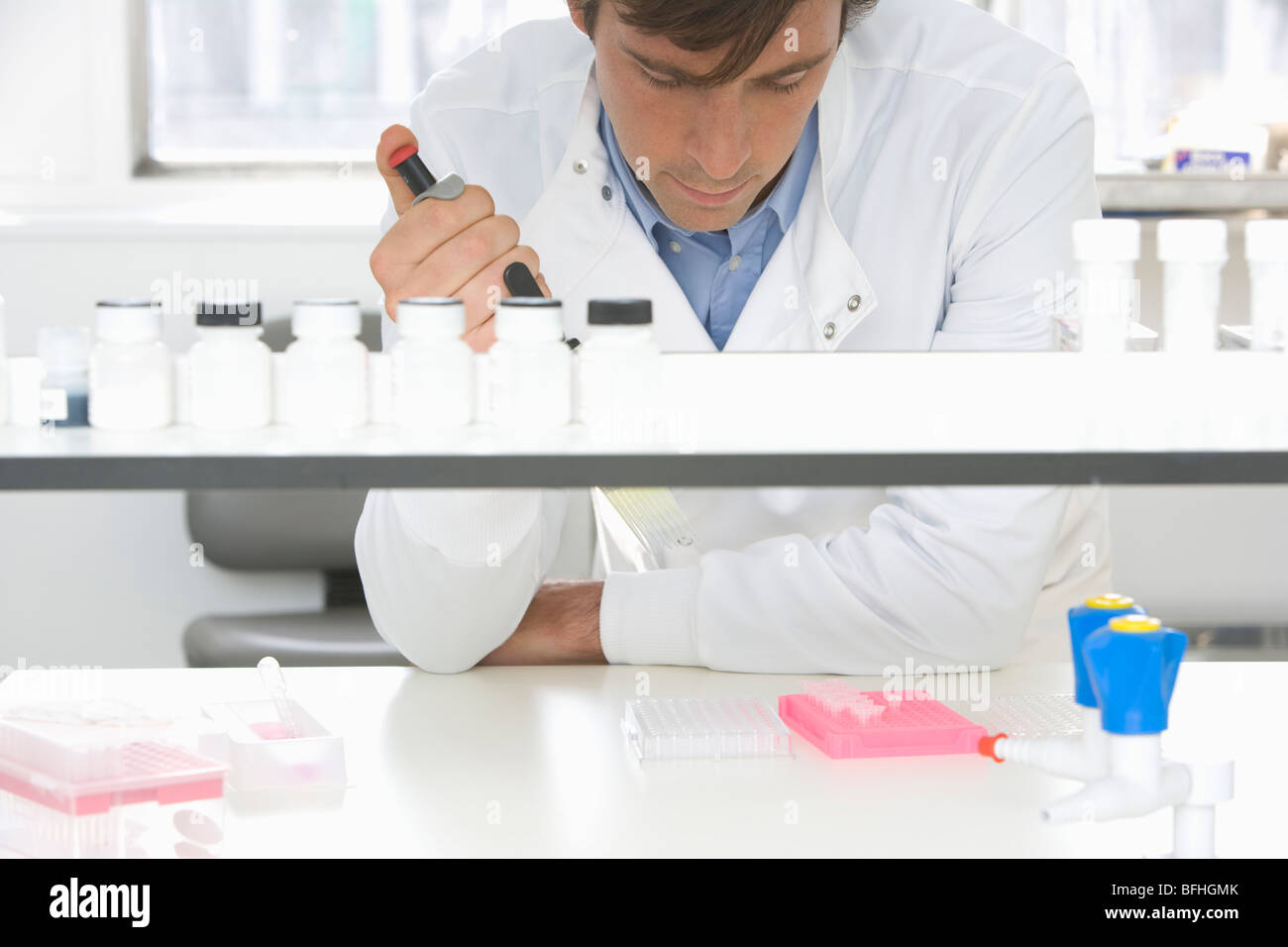 Scientist taking samples in laboratory Stock Photo - Alamy