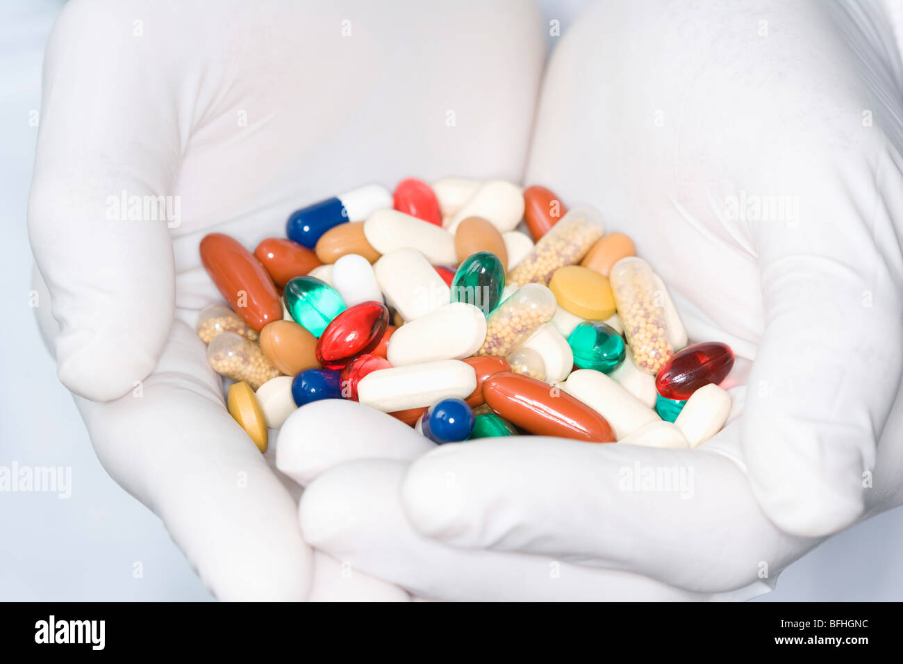 Various medication in hands Stock Photo - Alamy