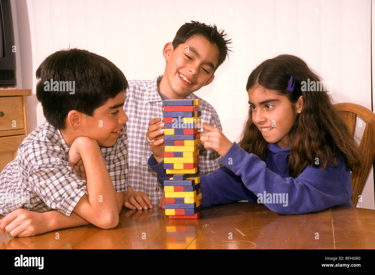 balance precision challenge fun fall collapse color Stock Photo - Alamy