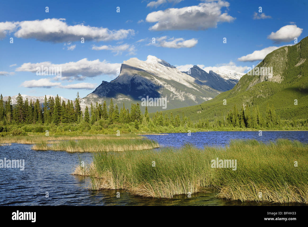 Mt Rundle rises above Vermillion Lakes near the town of Banff within ...