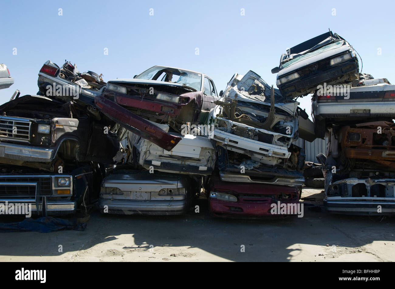 Stacked cars in junkyard Stock Photo - Alamy