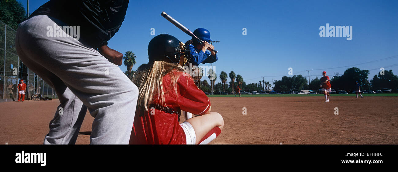 Teenage girl playing baseball hi-res stock photography and images - Alamy