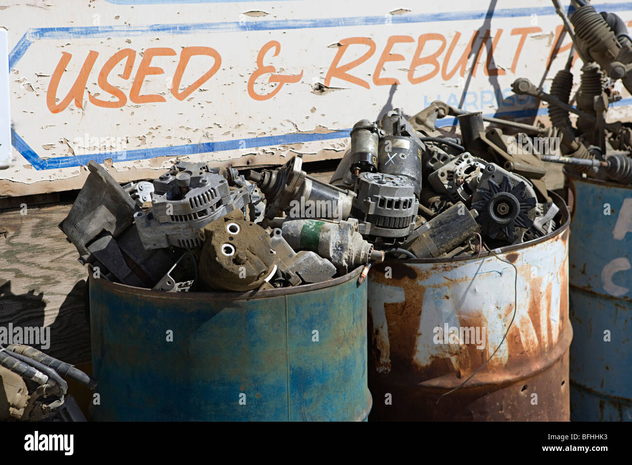 Rusty sign and barrels in junkyard Stock Photo - Alamy
