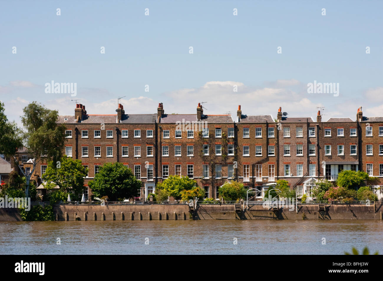 Houses along Chiswick Mall as seen from the River Thames in summer ...
