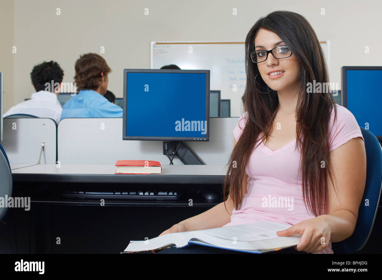 Female student sitting in computer classroom, portrait Stock Photo - Alamy