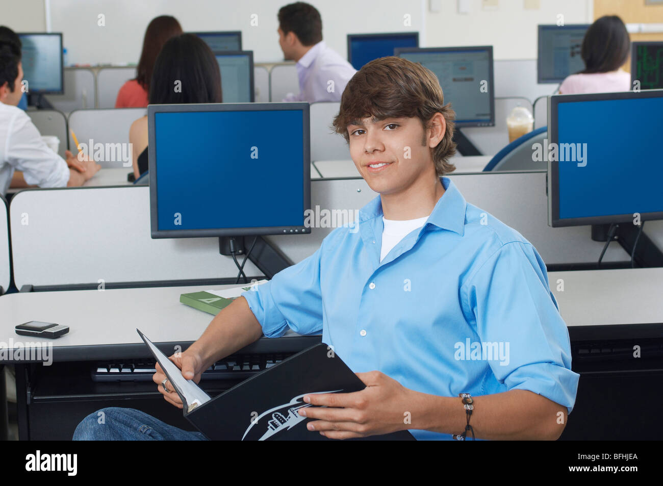Male student sitting in computer classroom, portrait Stock Photo - Alamy