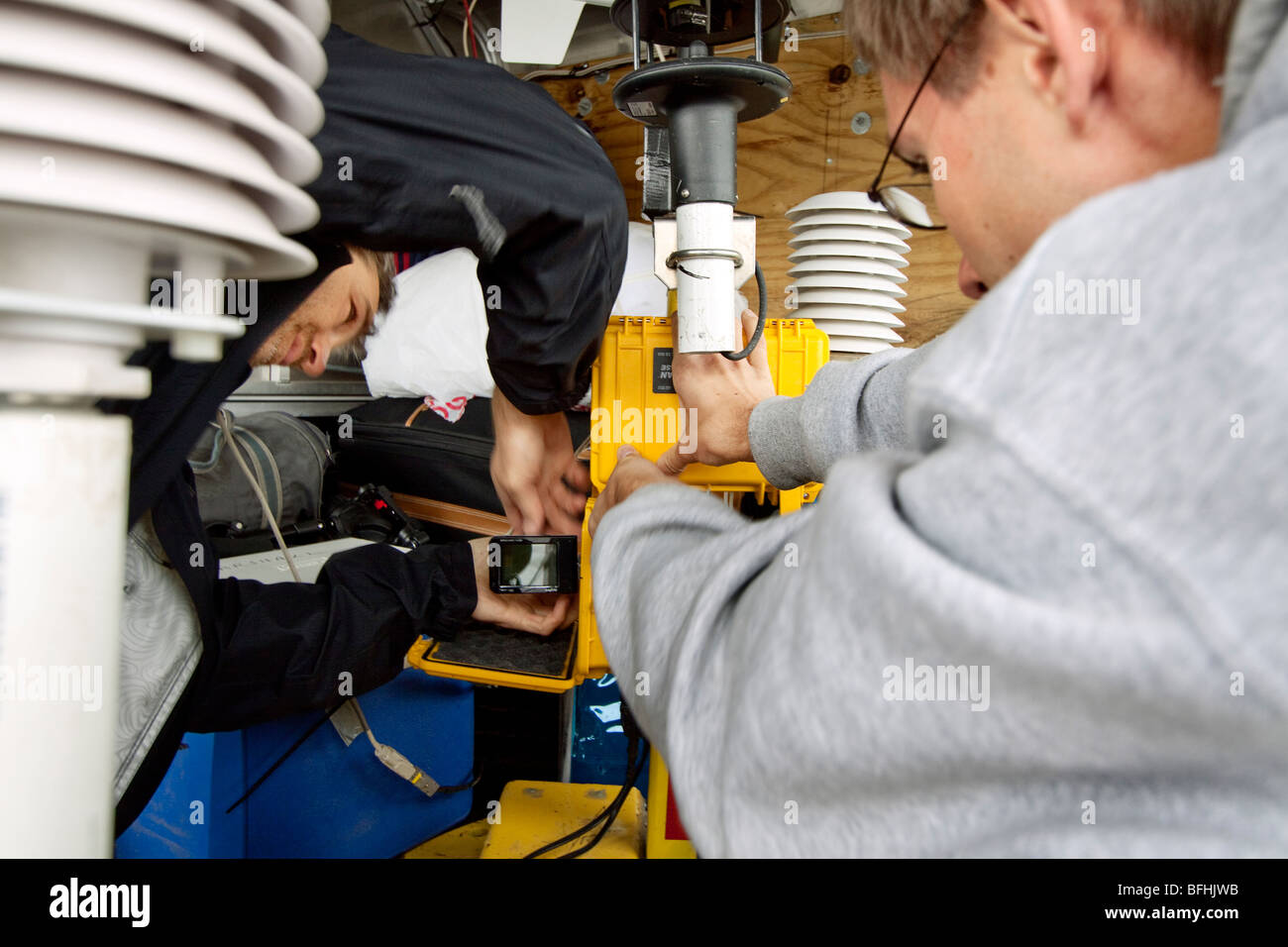 Brian Pollack (left) sets up a "tornado pod" in Wichita, Kansas, USA ...
