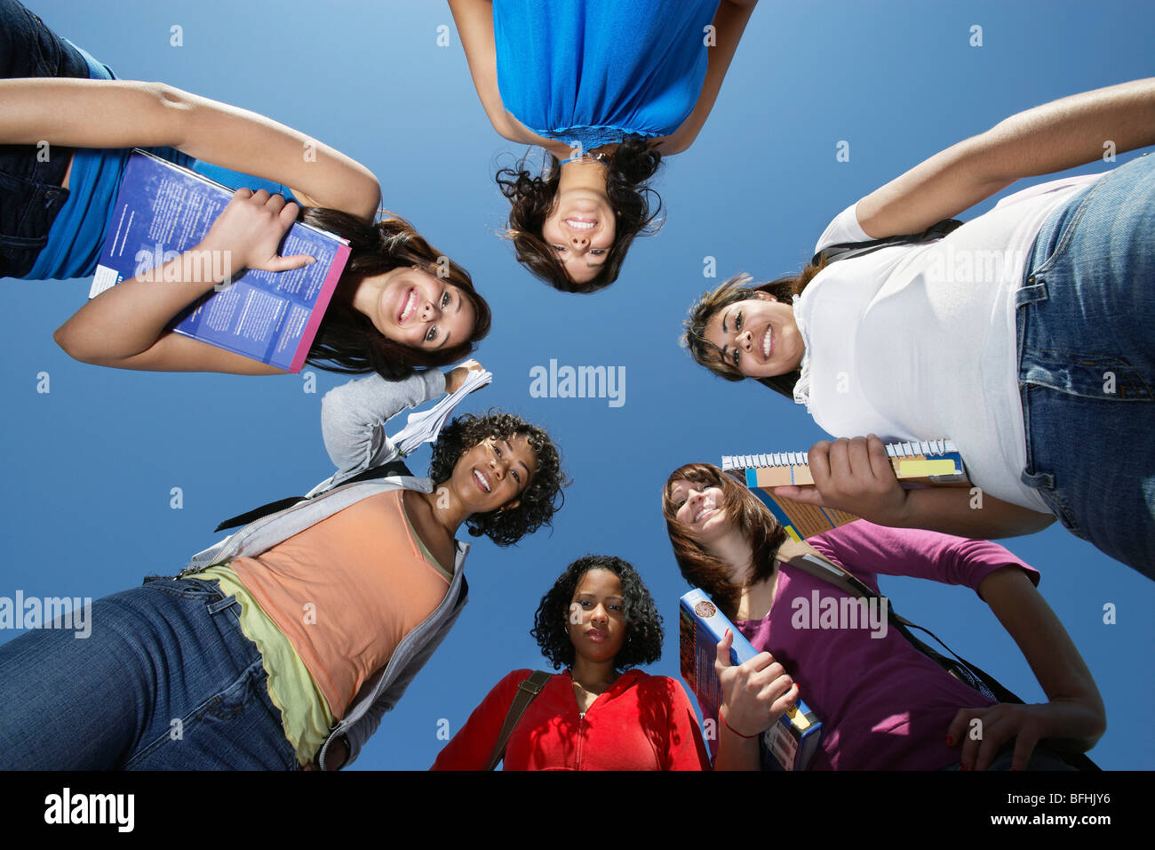 Female college students standing in circle, view from below Stock Photo ...