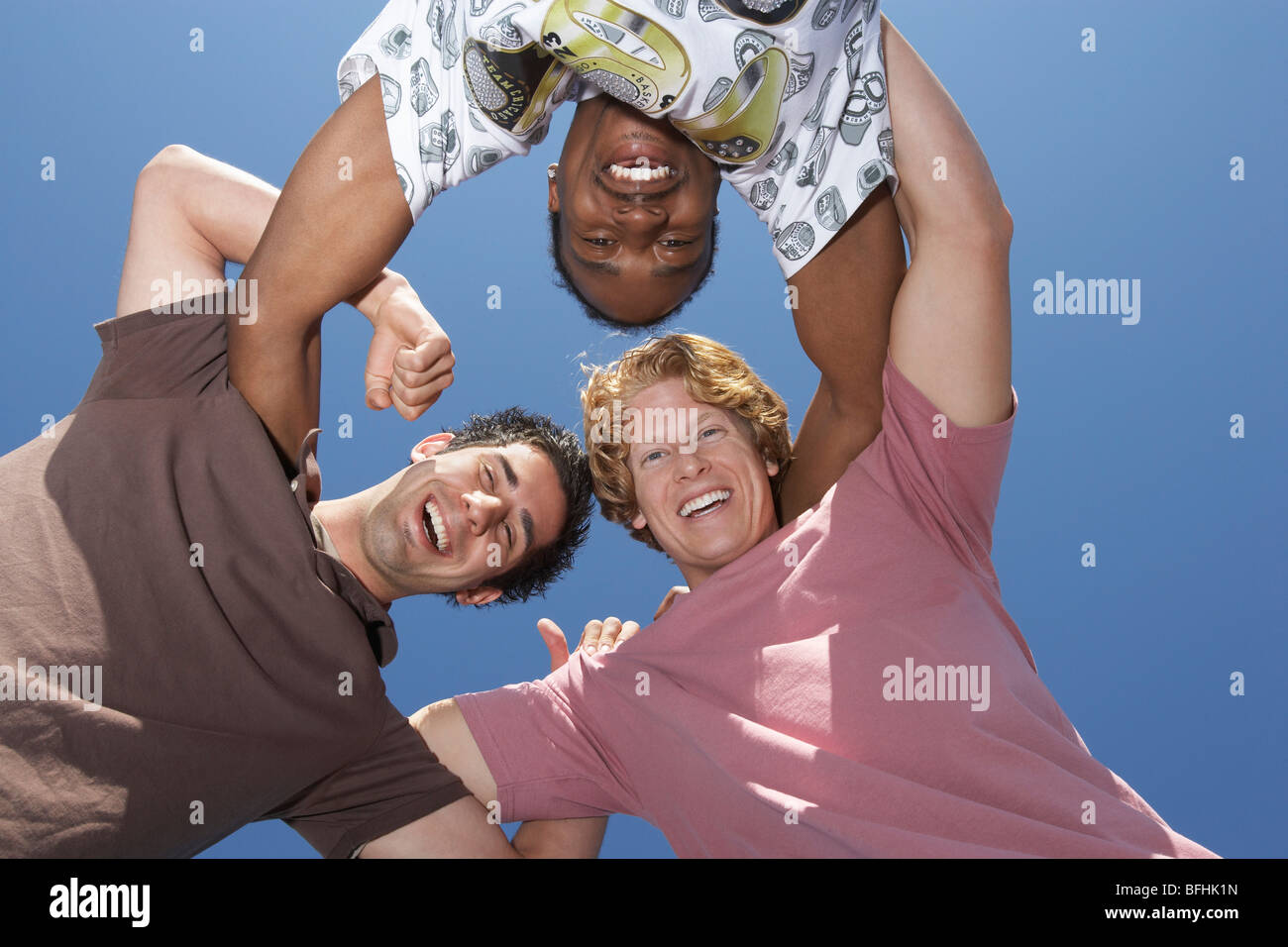 Cheerful men in huddle hi-res stock photography and images - Alamy