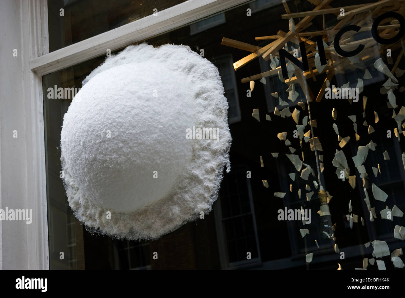 A fake snowball part of a shop window display in Mayfair, London, UK ...