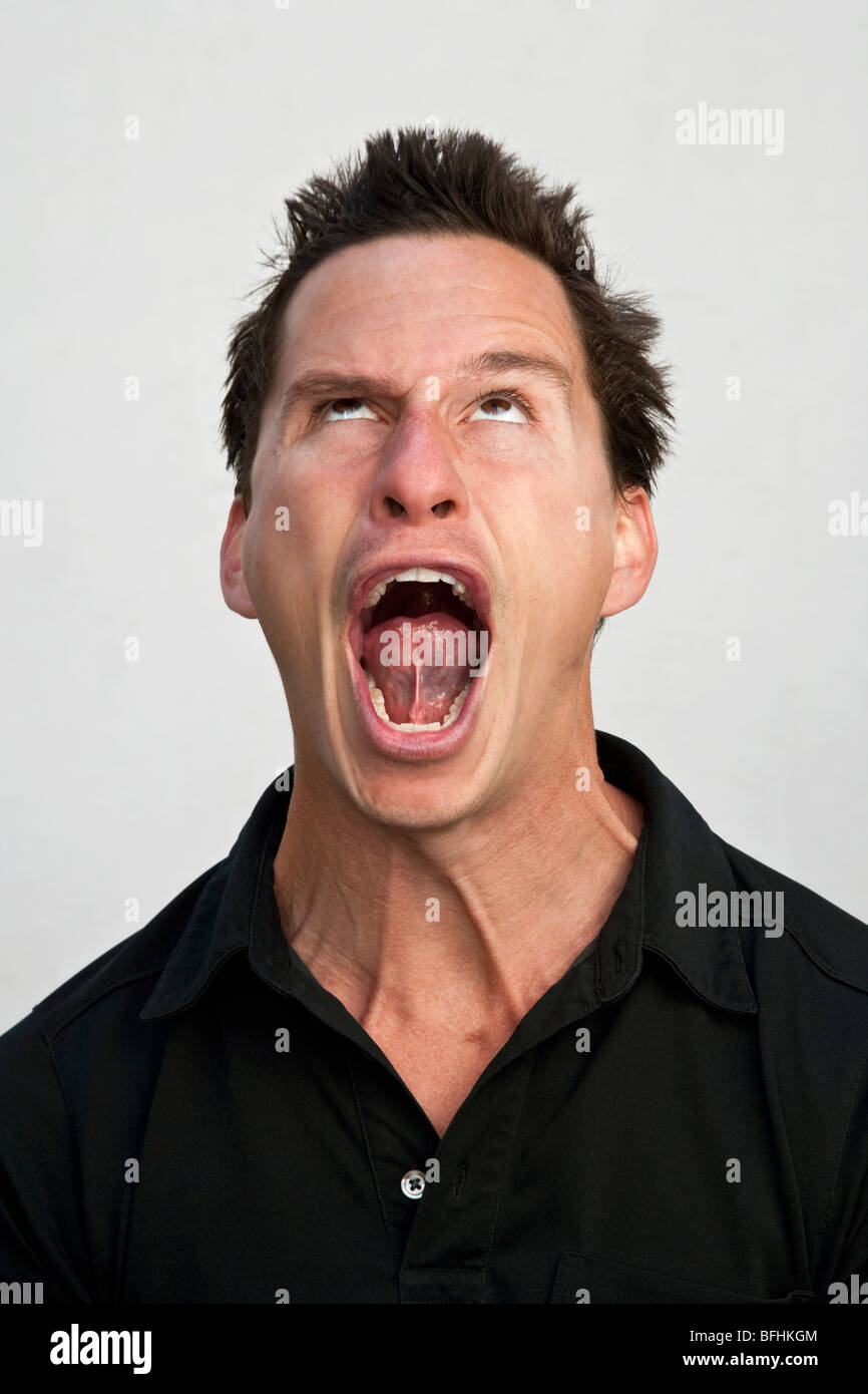 Expressive portrait of a young man Stock Photo - Alamy