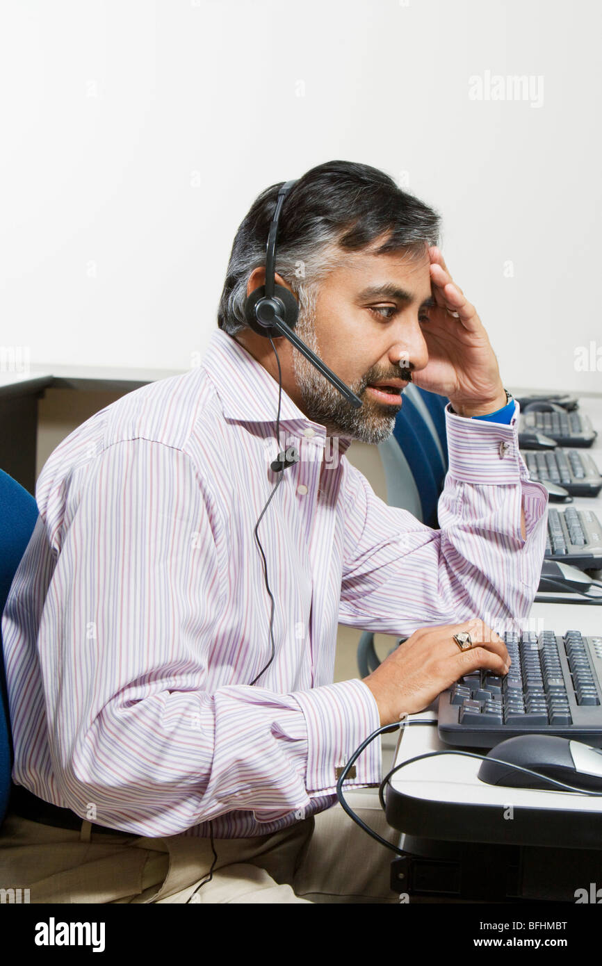 Businessman Using Telephone Headset Stock Photo - Alamy