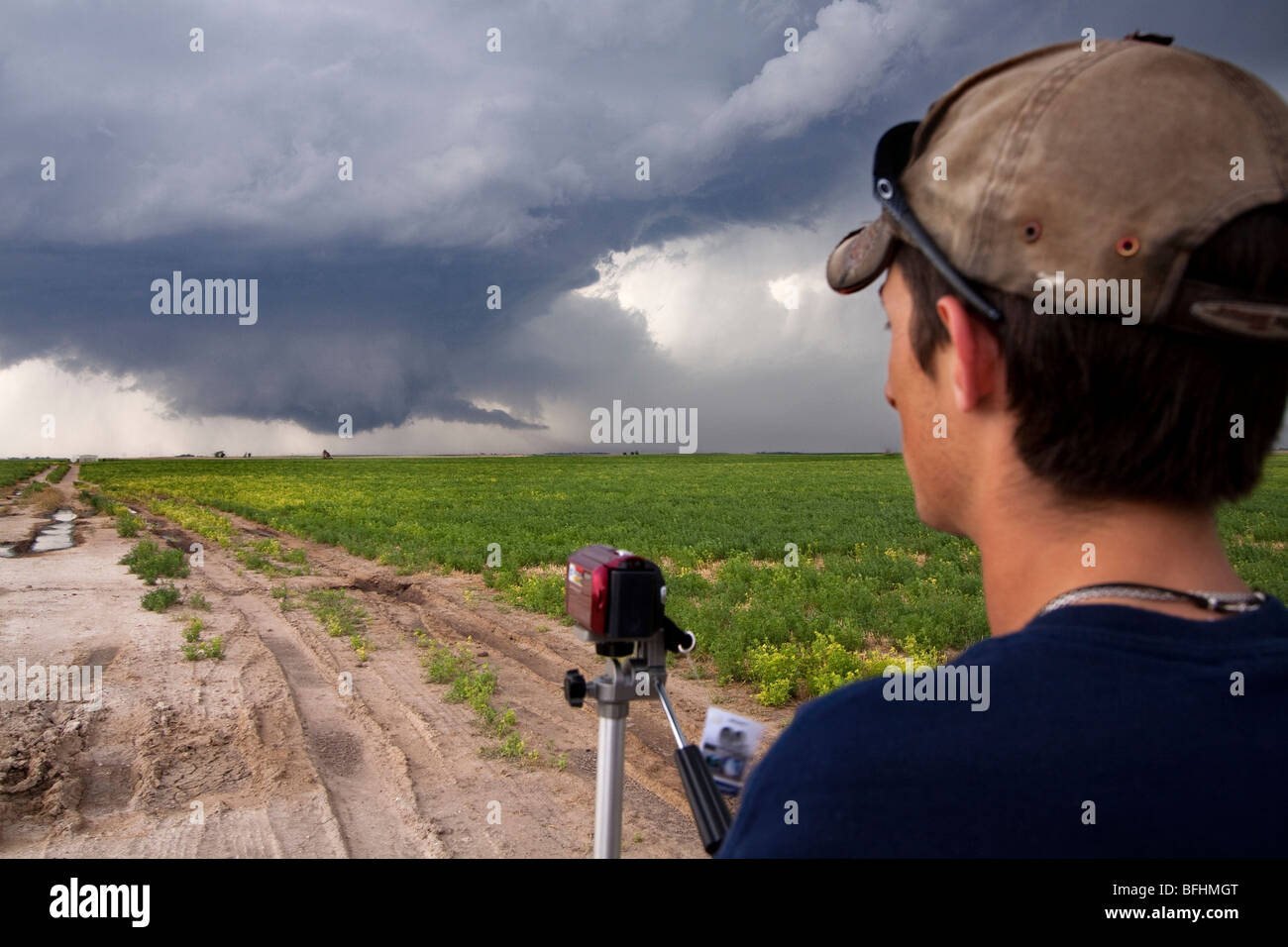 A storm chaser participating in Project Vortex 2 near Dodge City ...