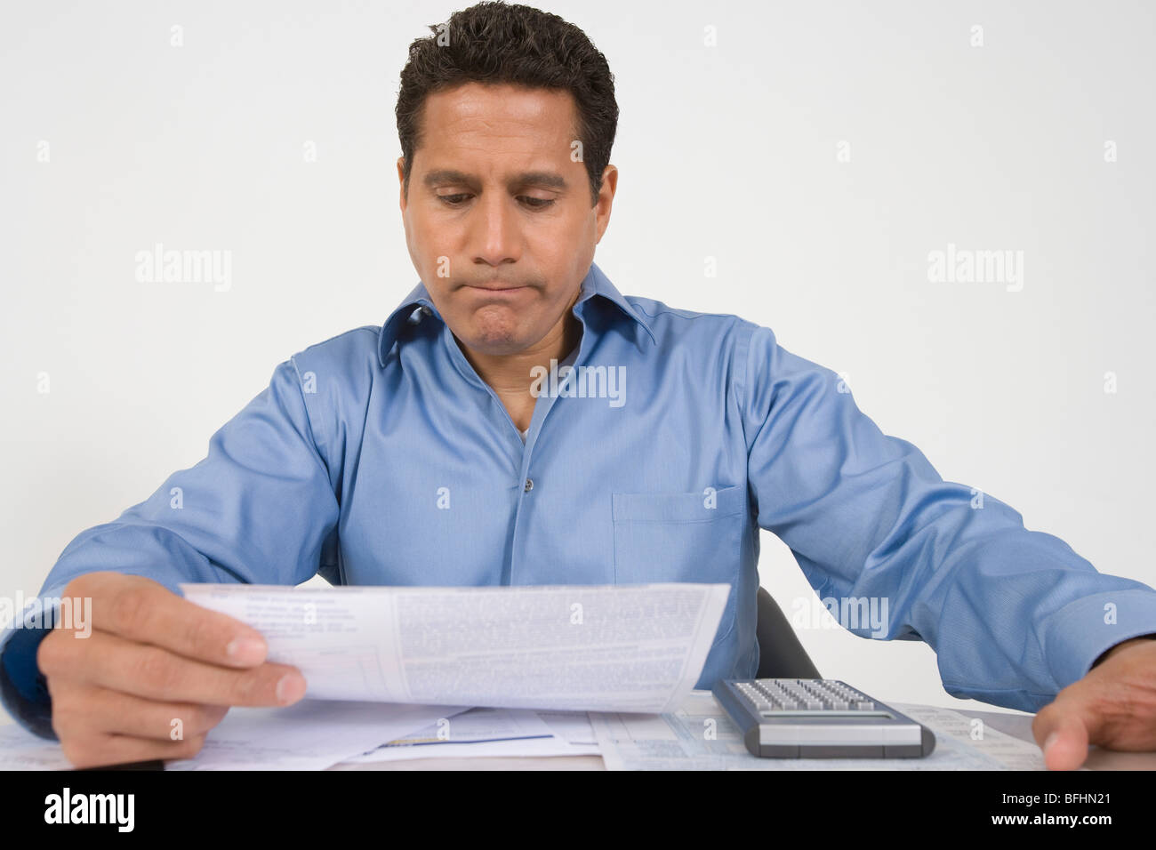 Man Reading Financial Document Stock Photo - Alamy