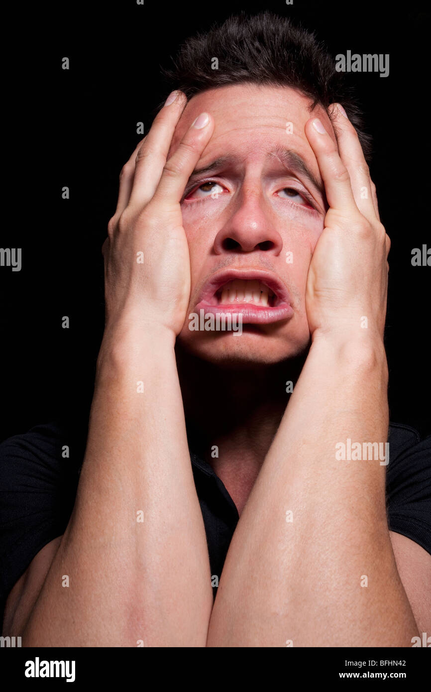 Expressive portrait of a young man Stock Photo - Alamy
