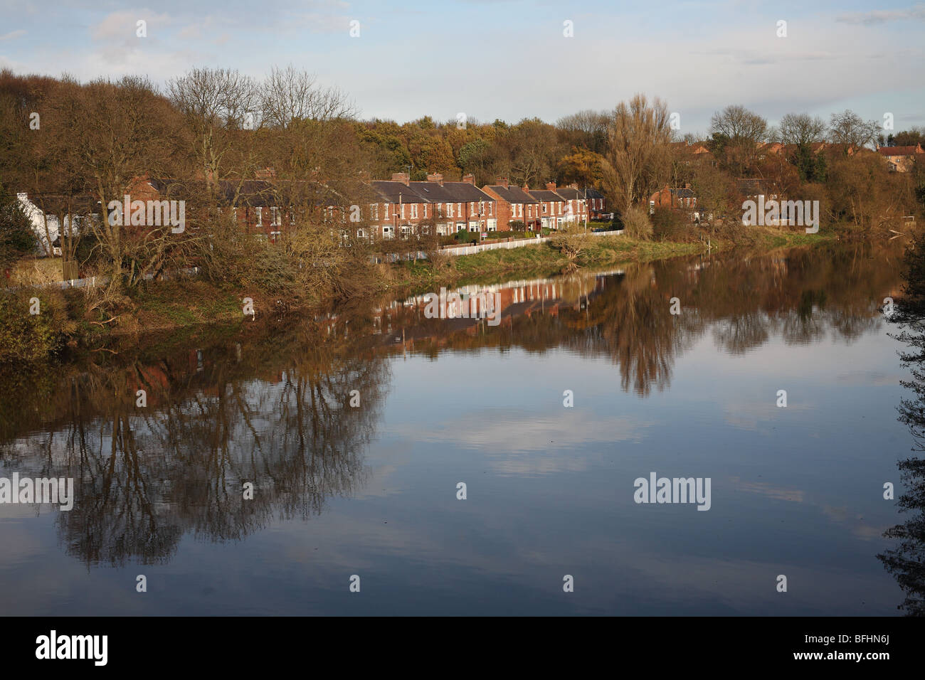 South View, a terrace of houses reflected in the river Wear and seen ...