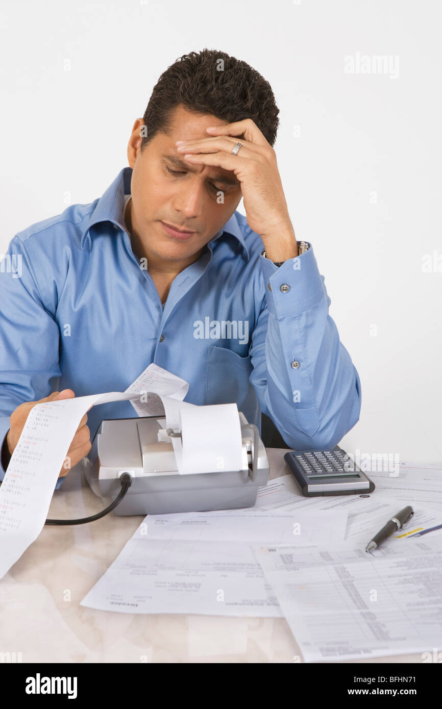 Man Calculating Finances Stock Photo - Alamy