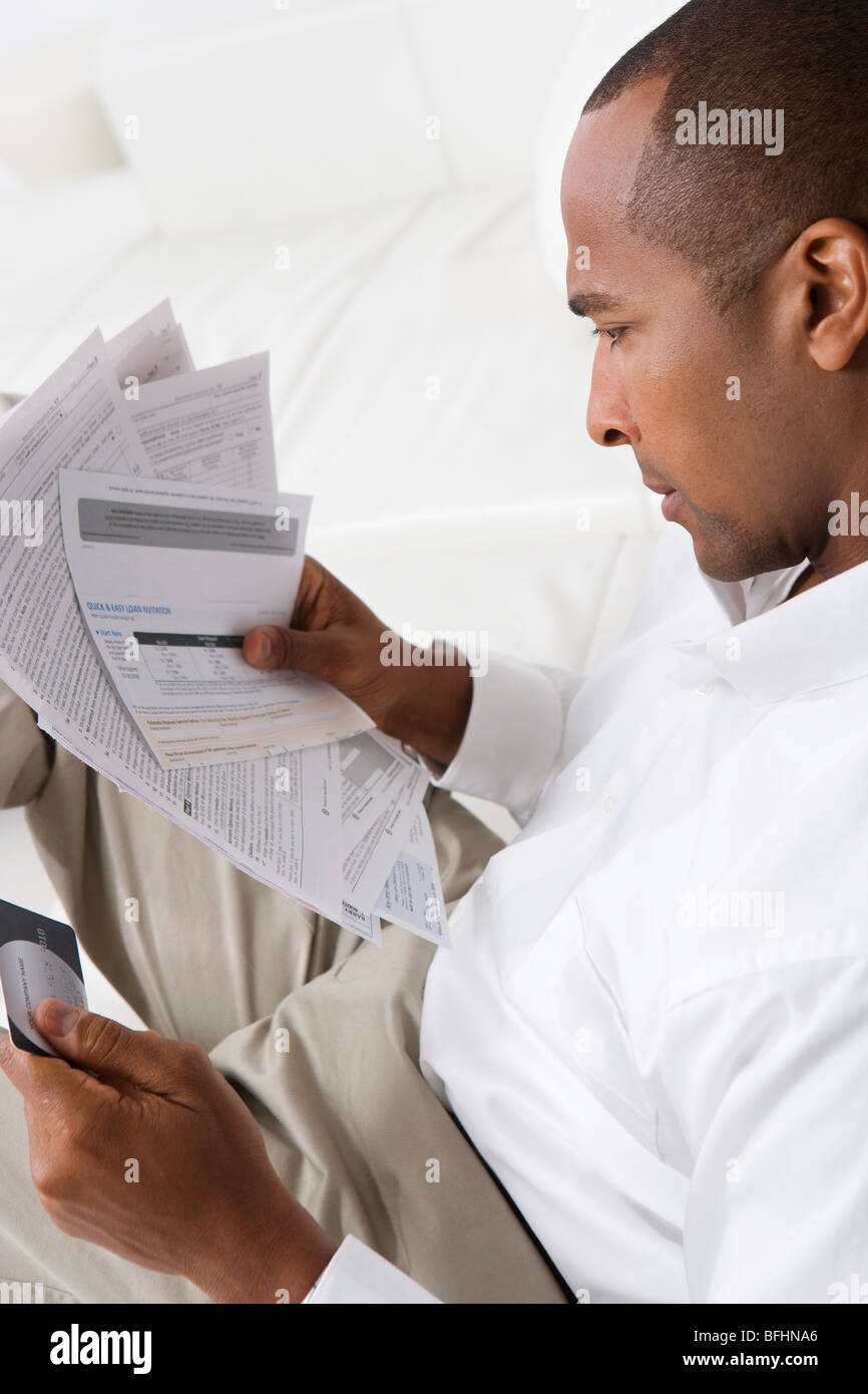 Man Checking Bills Stock Photo - Alamy