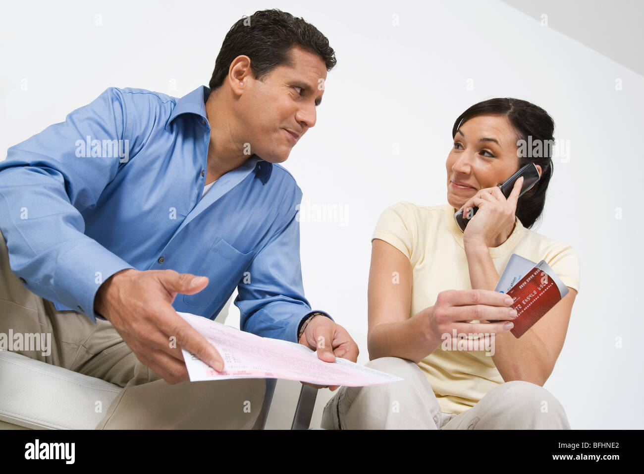 Couple Calling About Credit Card Bill Stock Photo - Alamy
