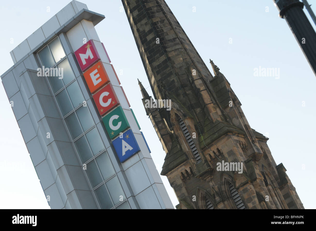 The word Mecca on a glass tower beside a Church spire Stock Photo - Alamy