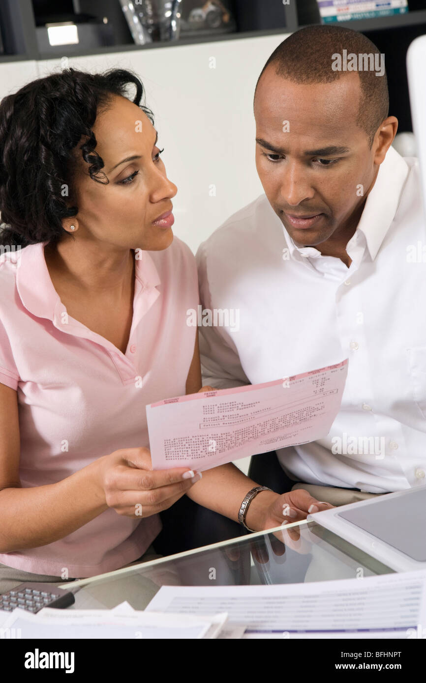 Couple Discussing a Bill Stock Photo - Alamy