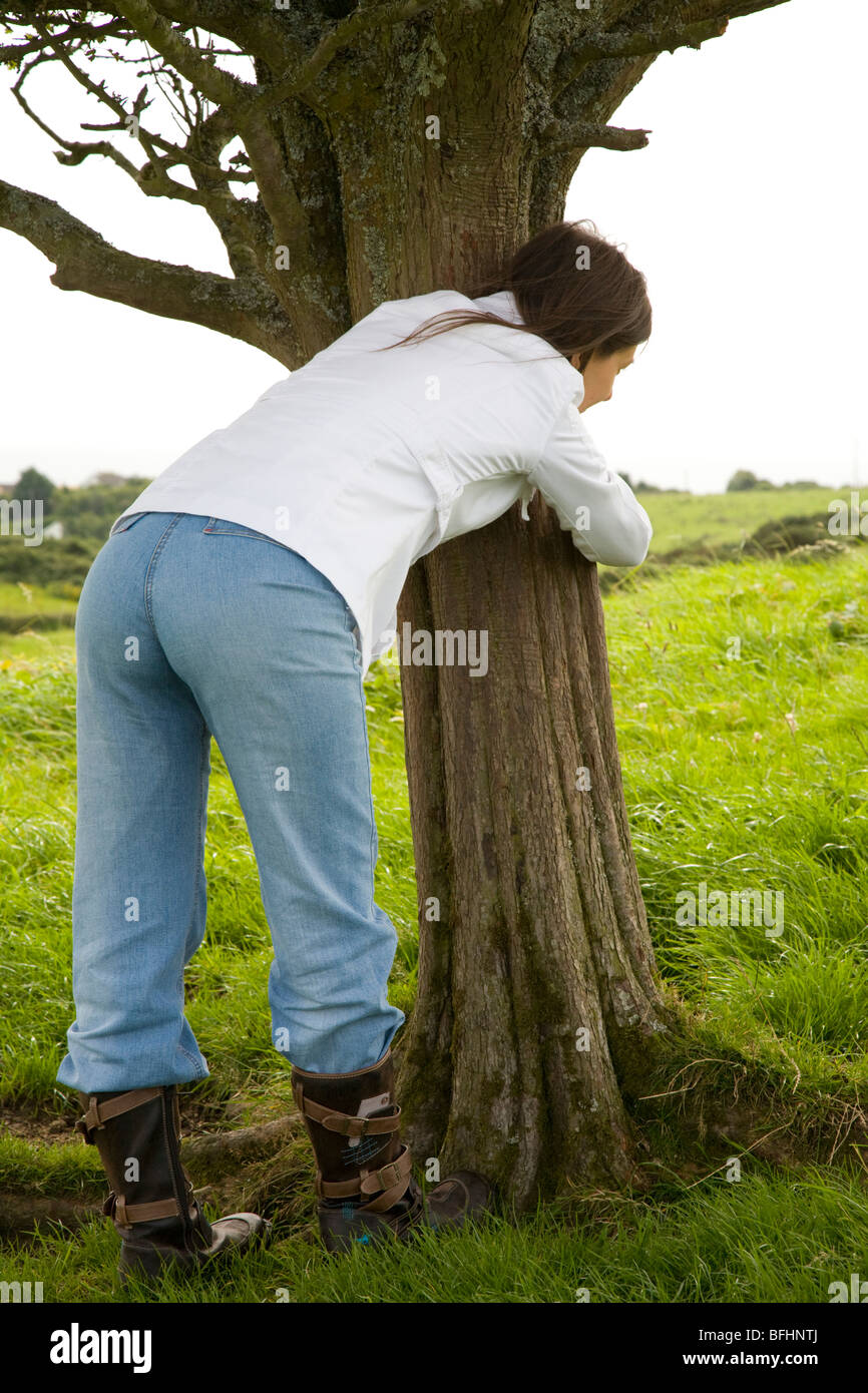 Girl hugging a fairy tree in County Wexford, Ireland Stock Photo - Alamy