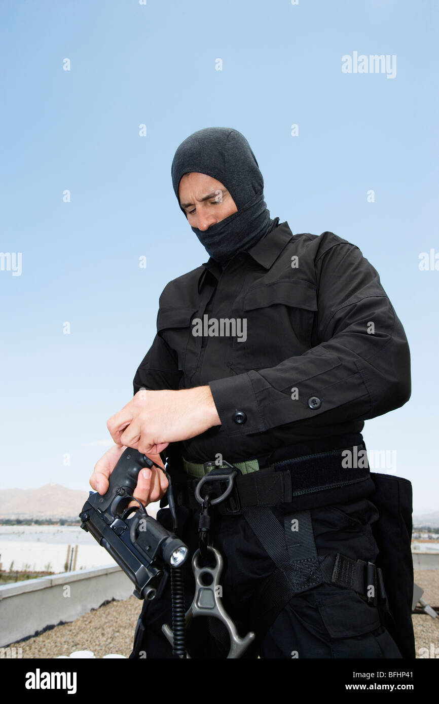 SWAT Team Officer Loading Pistol Stock Photo - Alamy