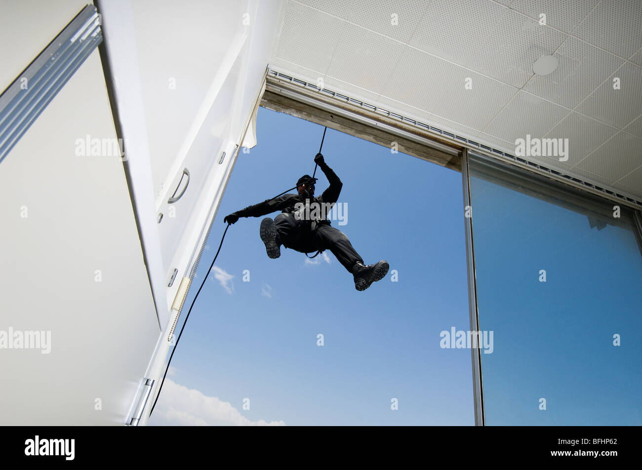 SWAT Team Officer Rappelling from Building Stock Photo - Alamy