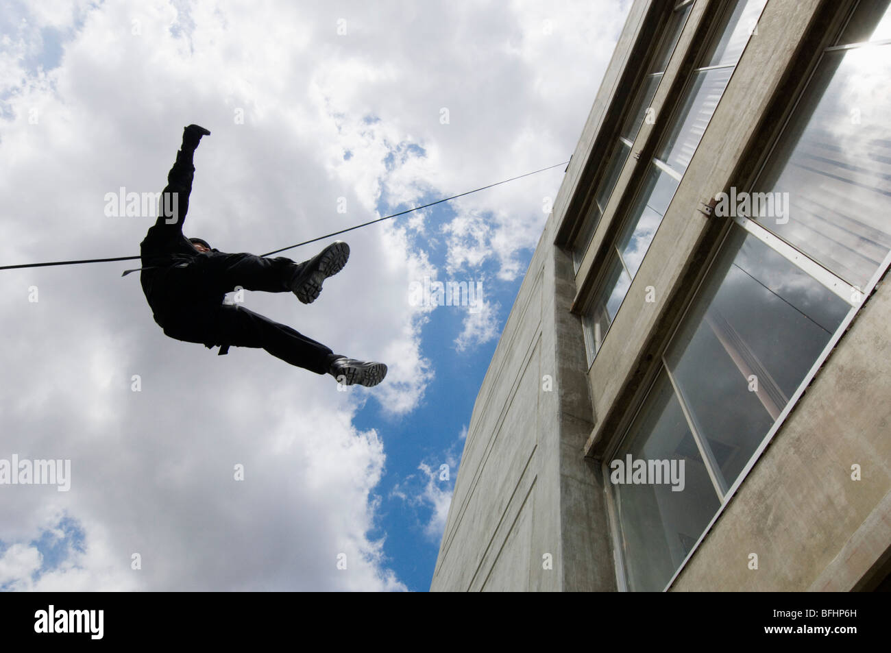 SWAT Team Officer Rappelling from Building Stock Photo - Alamy