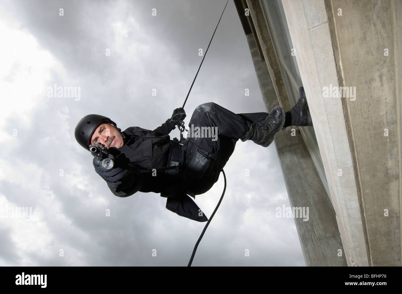 SWAT Team Officer Rappelling from Building Stock Photo - Alamy